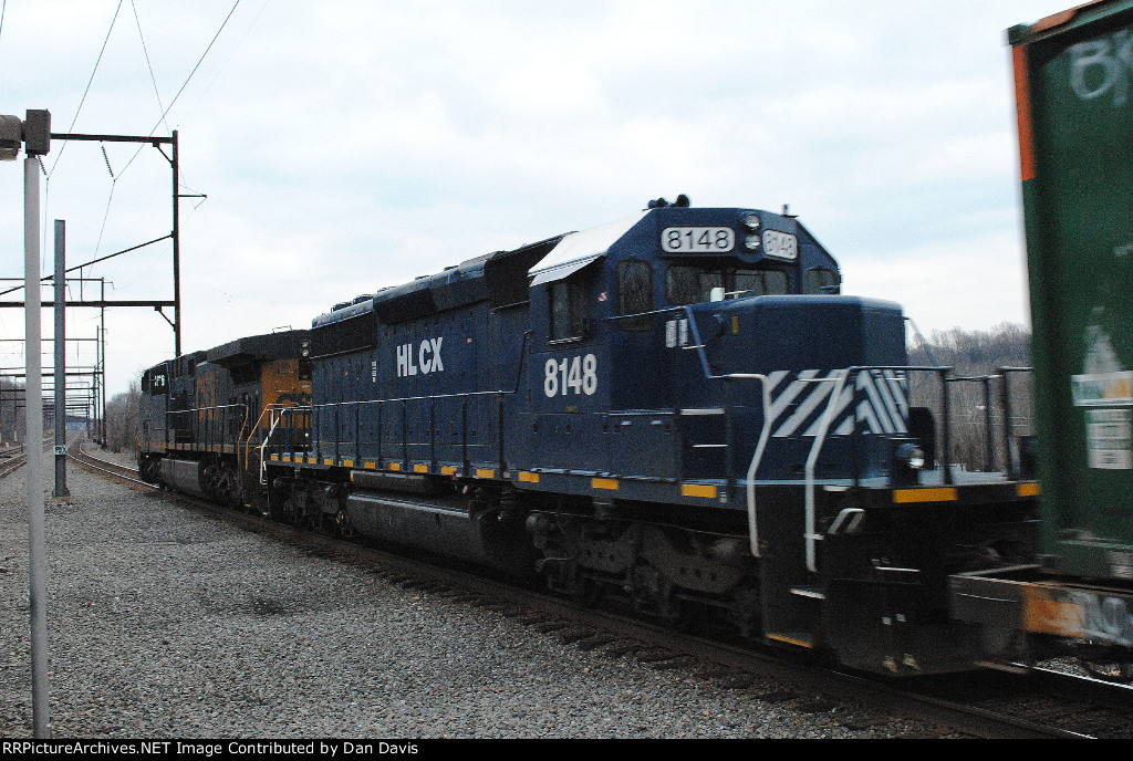 HLCX SD40-2 8148 trails on Q702-02